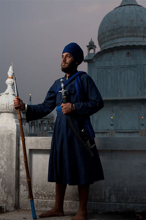Ornamental Dagger A Sikh Man Holds A Spear Sword And Dagger At The