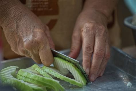 Premium Photo A Person Is Slicing A Guava Fruit
