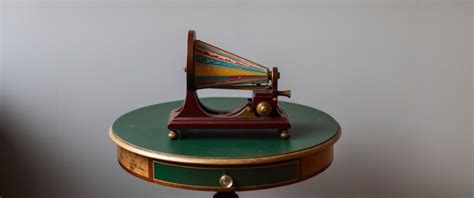 A Vintage Zoetrope On A Victorian Table Blending Art And Nostalgia