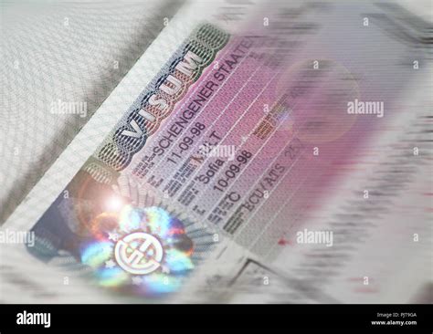 Schengen Visa Stamp In International Passport Shengen Document For