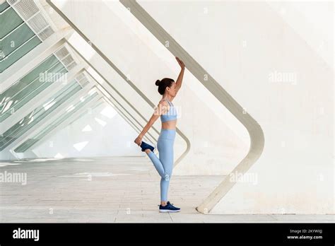 Sporty Woman Doing A Leg Stretch Warm Up Exercise Modern Urban