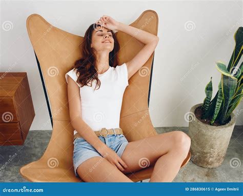 Woman Sitting In Leather Armchair Smile With Teeth Lifestyle In White T