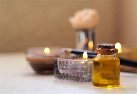 Premium Photo Massage Oil Bottle And Burning Candles