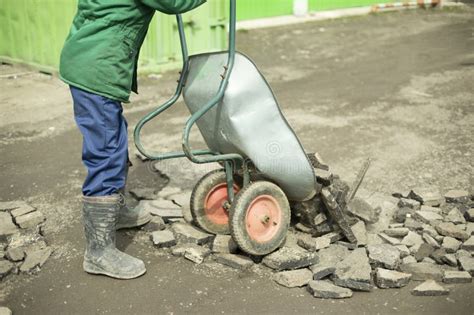 Builder Removes Broken Stone Man Carries Cobblestones In Cart Stock