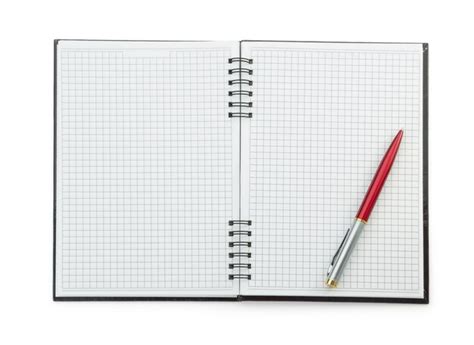 Premium Photo Pen On Checked Notebook Isolated At White