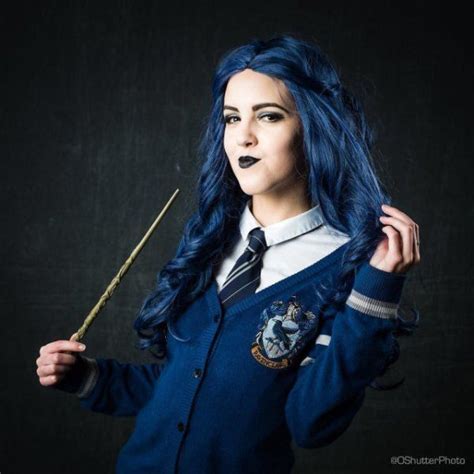 A Woman With Blue Hair Holding A Wand