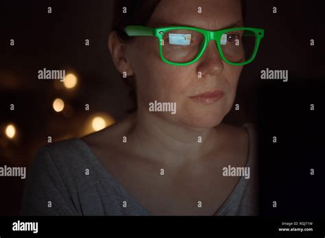 Woman Working Overtime On Laptop Computer Late At Night Low Key