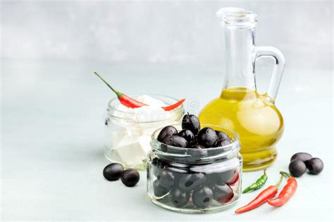 Olive Oil In Bottles With Black Olives And Leaves Copyspace On