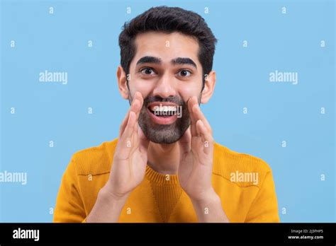 Portrait Of A Surprised Young Man Looking At The Camera With Mouth