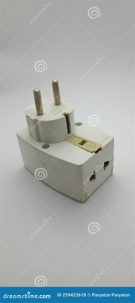 Three Prong Socket Adapter With Grounding On A Dark Background Royalty