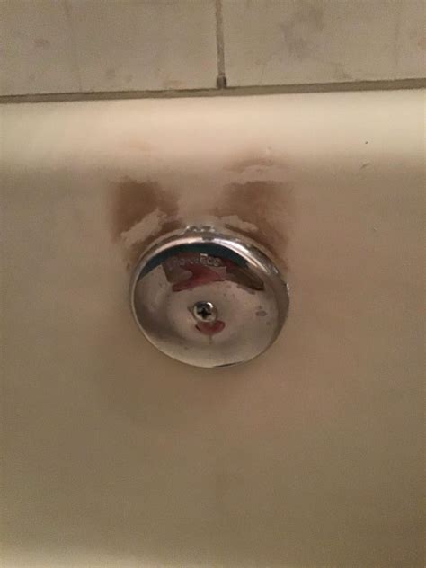 What Is This Discoloration On My Bathtubs Overflow Drainthis