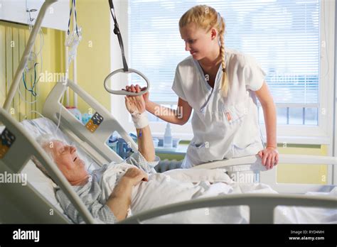 A Nurse Takes Care Of A Patient In A Hospital Bed Karlovy Vary Czech
