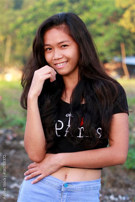 Pretty Young Filipina Looking Through The Camera Environmental