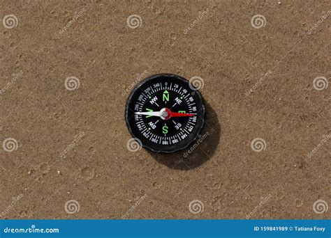 A Compass Pointing North On A Plain White Background With Empty Space