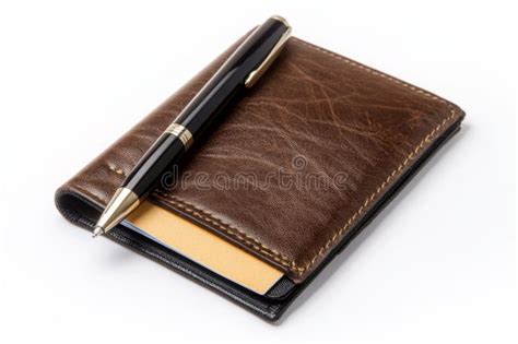 A Stylish Brown Leather Notebook Paired With A Sleek Black Pen Perfect For Jotting Down Ideas