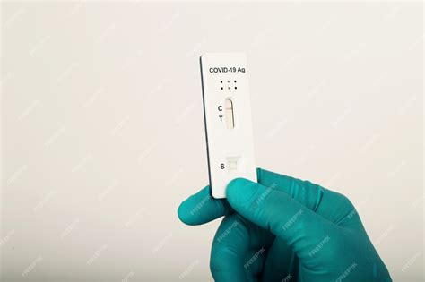 Premium Photo Covit Testing With A Test Strip For Treatment Accuracy