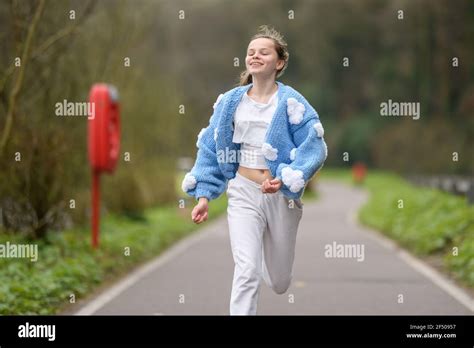 Girl Running On A Path Stock Photo Alamy