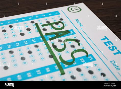 Answer Sheet With Word Pass On Wooden Table Closeup Student Passing