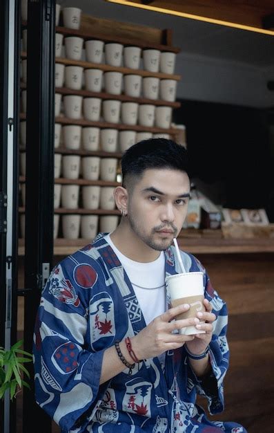 Premium Photo Portrait Of Man Holding Coffee Cup