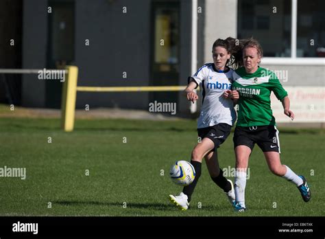 Going For The Ball Two Young Women Girls Playing Football Soccer Stock