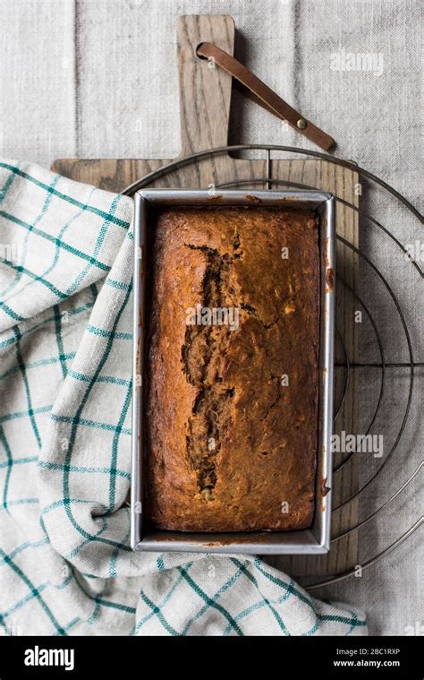 Fresh Whole Wheat Banana Bread Sitting On A Cooling Rack Stock Photo Alamy