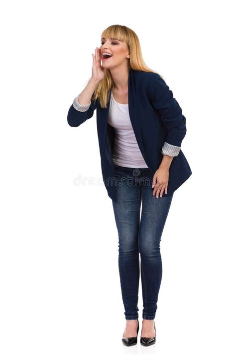 Young Woman In White T Shirt And Jeans Is Standing Tiptoe And Waving