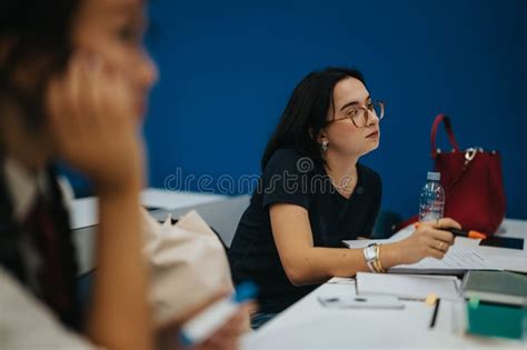 Students Focus On Tasks During Classroom Learning Session Stock Image