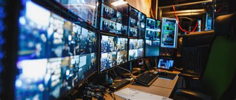 Security Operator Monitoring Multiple Screens In A Control Room Premium Ai Generated Image
