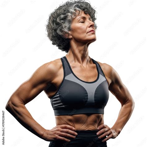 Fit Older Woman Confidently Posing With Sculpted Muscles After Workout
