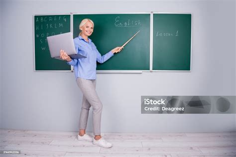 Photo Of Charming Clever Senior Woman School Teacher Conducting