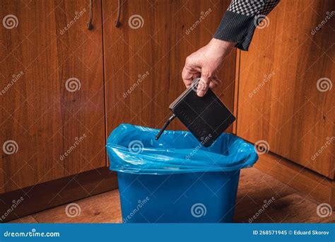 A Man Throws A WiFi Router In The Trash Man S Hand With A WiFi Router