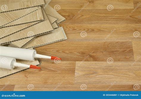 Set Of Items For Pvc Ceiling Indoor Works Assembly Adhesive Bottles And Pvc Panels With Plastic