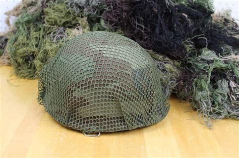 Vintage Military Helmetand Camouflage Netting