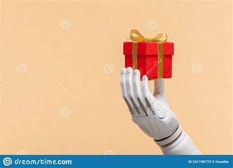 A Bionic Prosthetic Arm Or Forearm In White On A Beige Background Holds