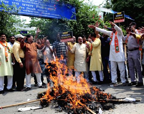 Bjp Workers Burn An Effigy Of Delhi Cm Arvind Kejriwal