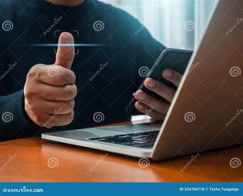 Fingerprint Scan Icon On Virtual Screen While Businessperson Finger