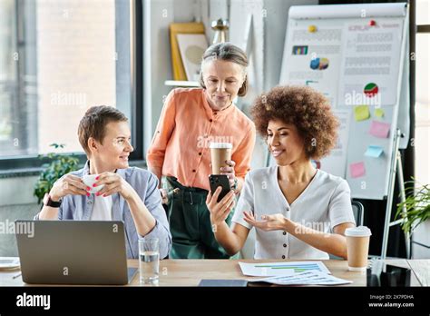 A Group Of Hardworking Diverse Businesswomen Sitting Around A Table Collaborating In An Office