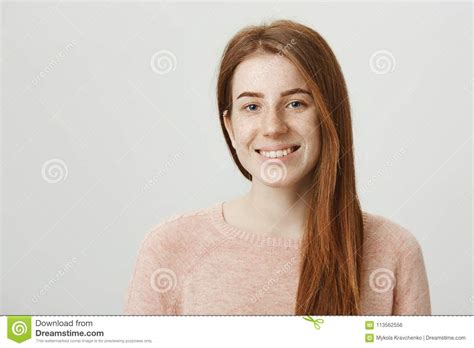 Close Up Portrait Of Interesting And Cute Redhead Female Model Smiling