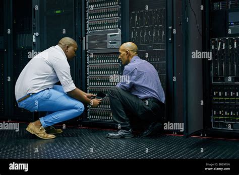 Server Room Men Or Technicians Talking About Hardware Together For A Cybersecurity Glitch With