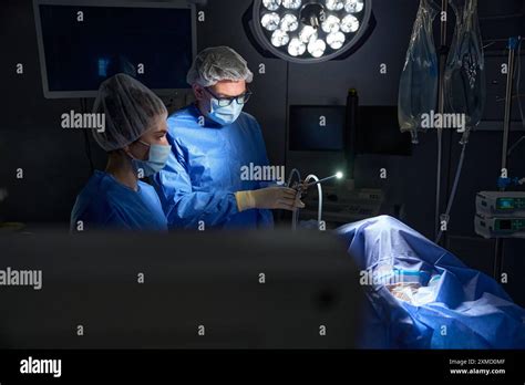 Doctors During Gynecological Surgery Operation Using Laparoscopic Equipment In Hospital Stock