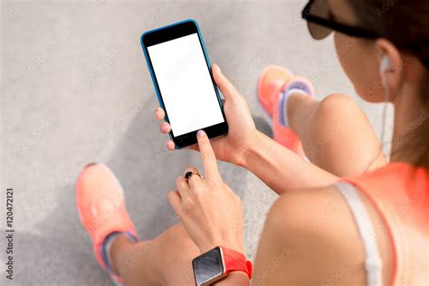 Sports Woman Holding A Smart Phone With Empty Screen To Copy Paste