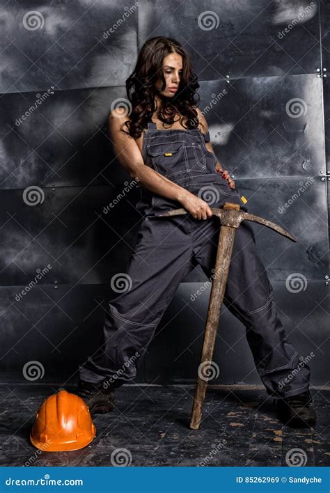 Female Miner Worker With Pickaxe In Coveralls Over His Naked Body Erotic Industry Concept
