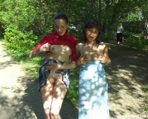 Naughty White And Asian Chicks Having Lesbian Sex In The Park 10 Photos