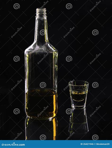 Whiskey Bottle With Shot Glass Royalty Free Stock Image Image 26421946