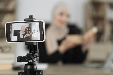 Premium Photo Arab Woman Using Smart Phone Camera For Creating Content