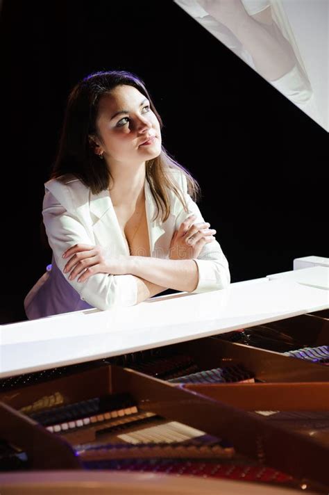 The Woman With White Piano Beautiful Pianist On The Stage Near The