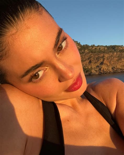 Kylie Jenner Flaunts Her Figure In A Plunging Black Minidress On A Yacht