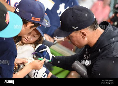 New York Yankees Center Fielder Aaron Judge 99 Signs A FanÕs Jersey