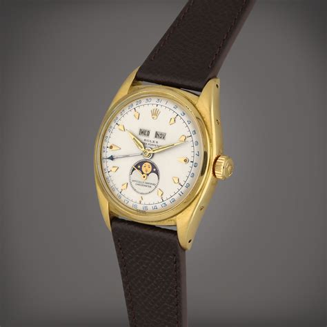 Reference 6062 | A yellow gold triple calendar wristwatch with moon ...