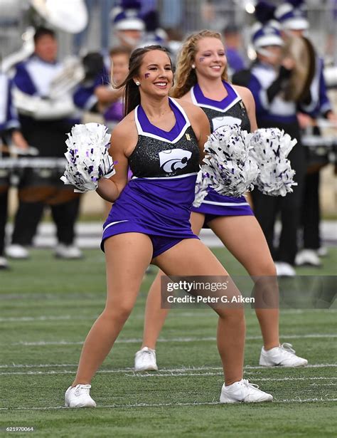 A Kansas State Wildcats Cheerleader Performs During A Game Against